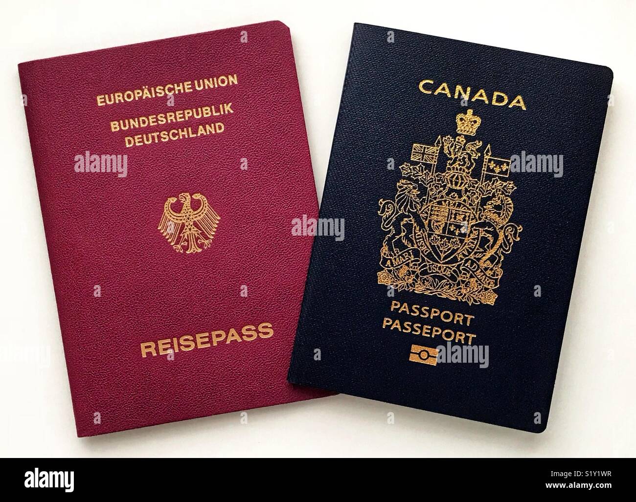 Two passports: European Union and Canada Stock Photo - Alamy