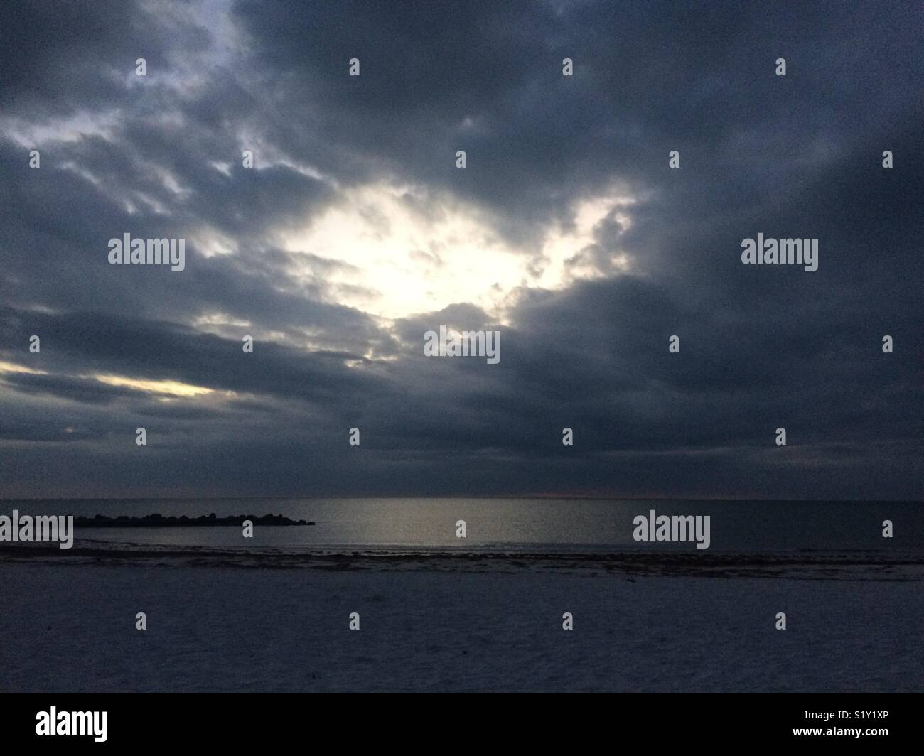 Cloudy sun set Stock Photo - Alamy