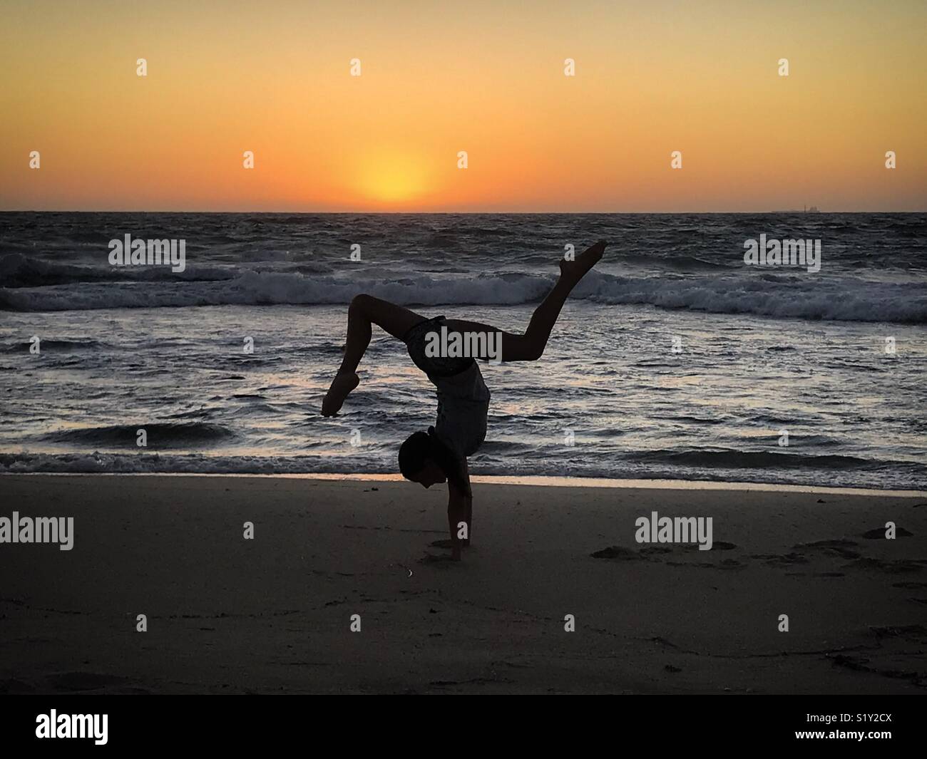 Girl doing handstand hi-res stock photography and images - Alamy