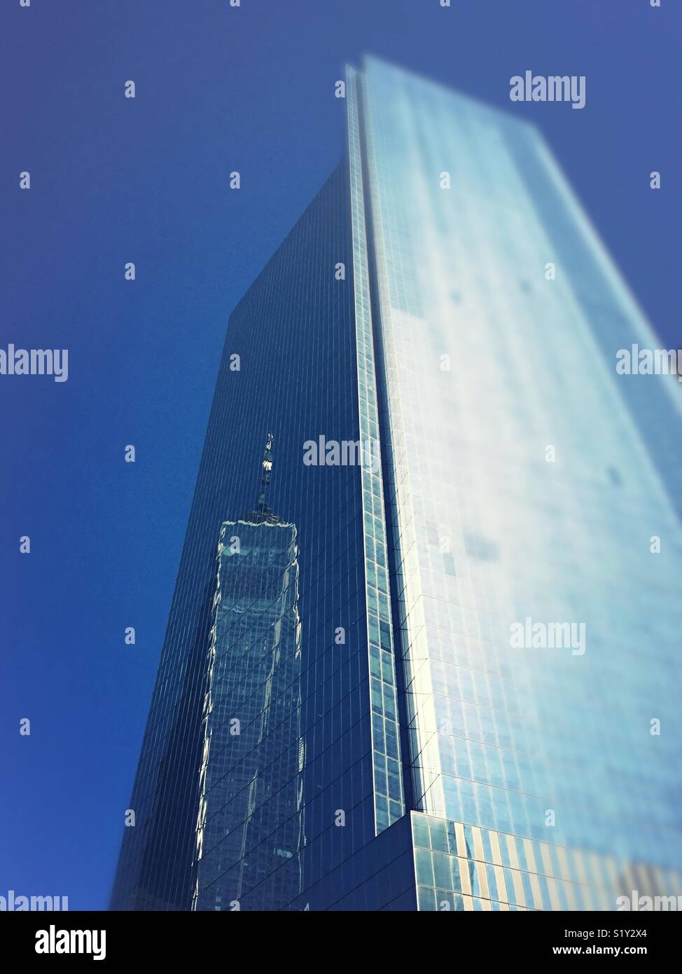 Reflection of the freedom Tower in newly completed 3 World Trade Center ...