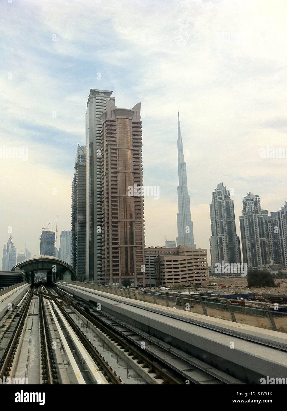 Railway line and view of downtown Dubai with Burj Khalifa, tallest ...