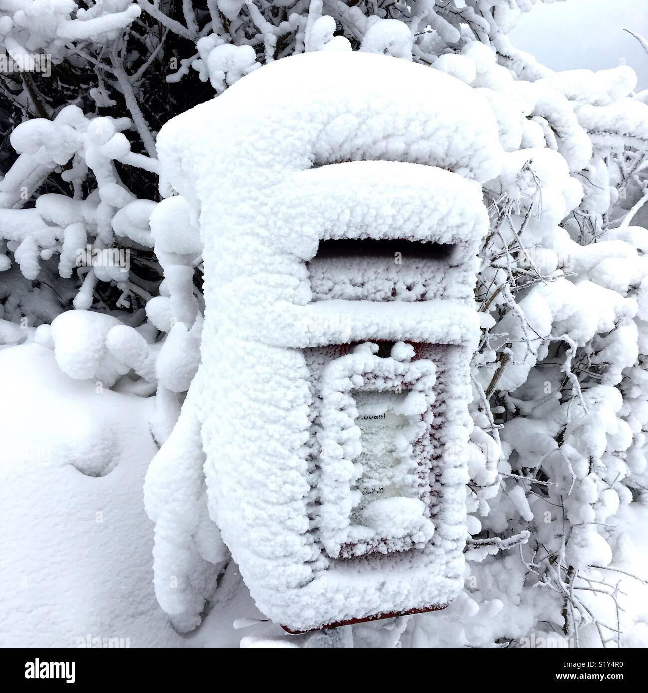 Snow covered post box seen during the Beast From The East storm that ...