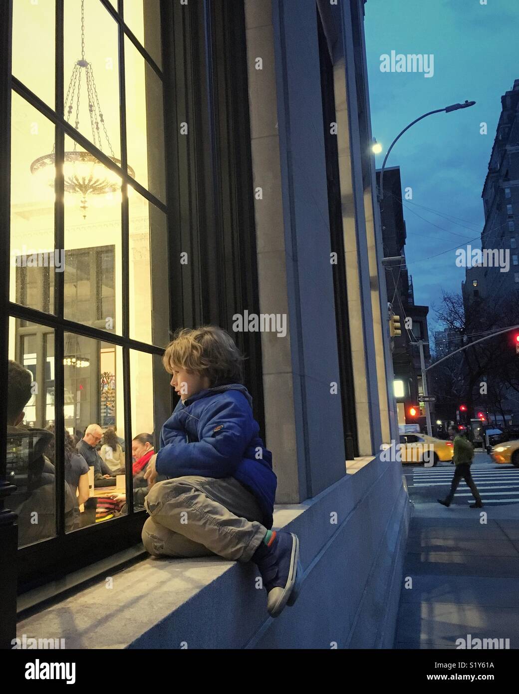 Boy looking at shop window hi-res stock photography and images - Alamy