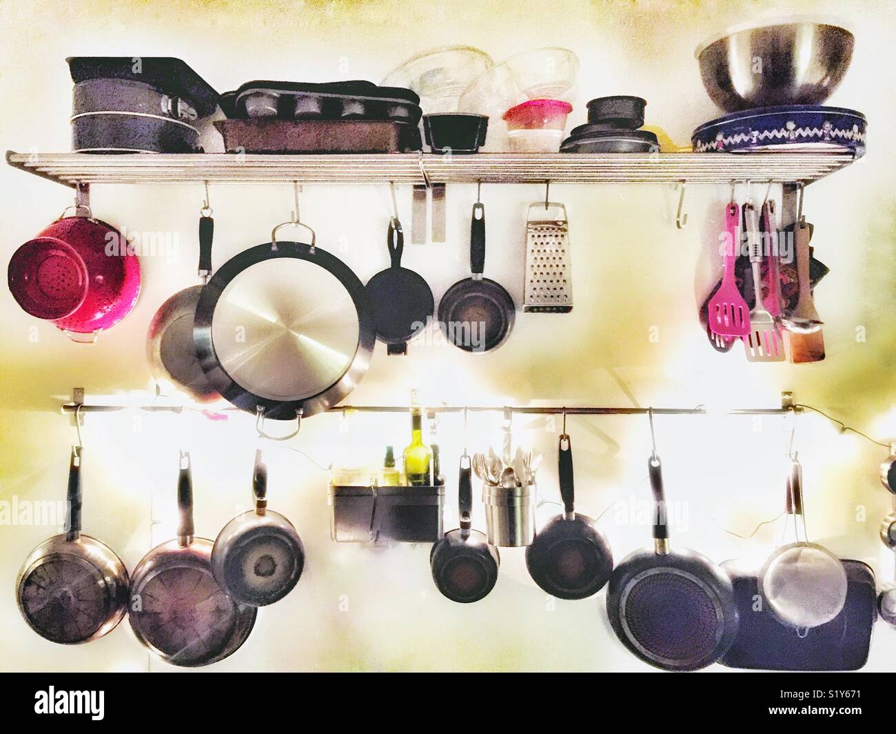 Kitchen utensils on a wall Stock Photo - Alamy