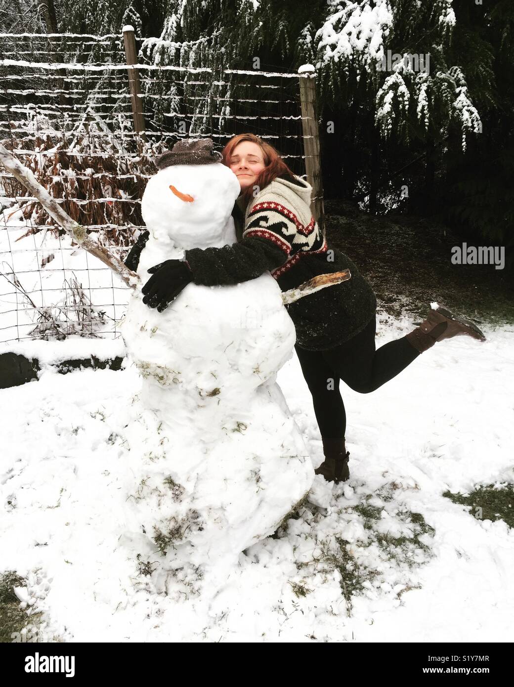 Snowfall in March. Obligatory snowman photo, she is so so happy Stock ...