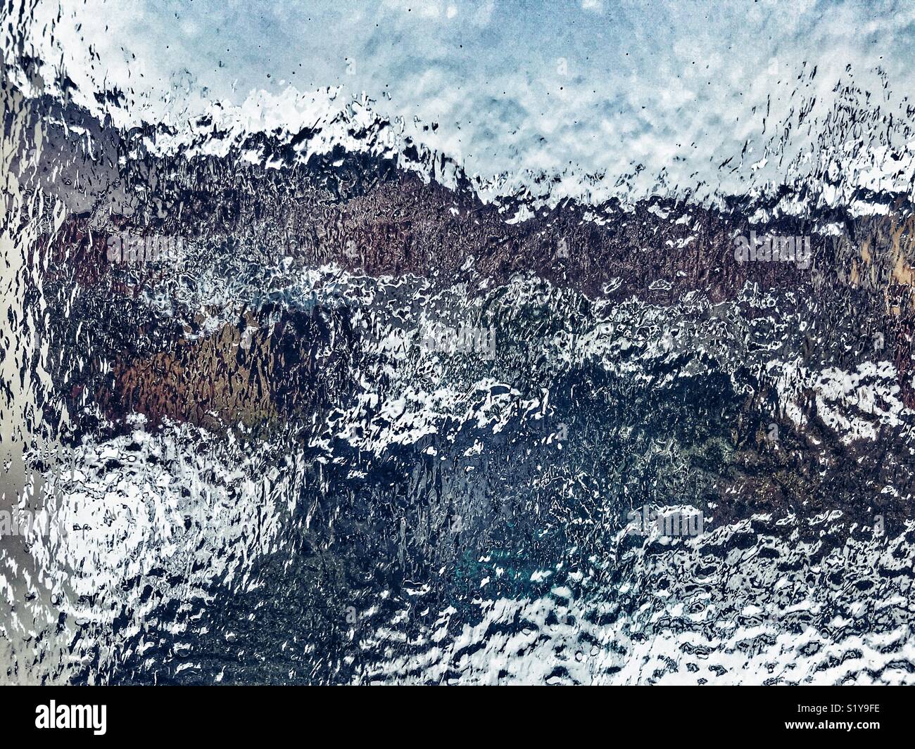 Freezing rain on the window of a house. Freezing rain is precipitation ...