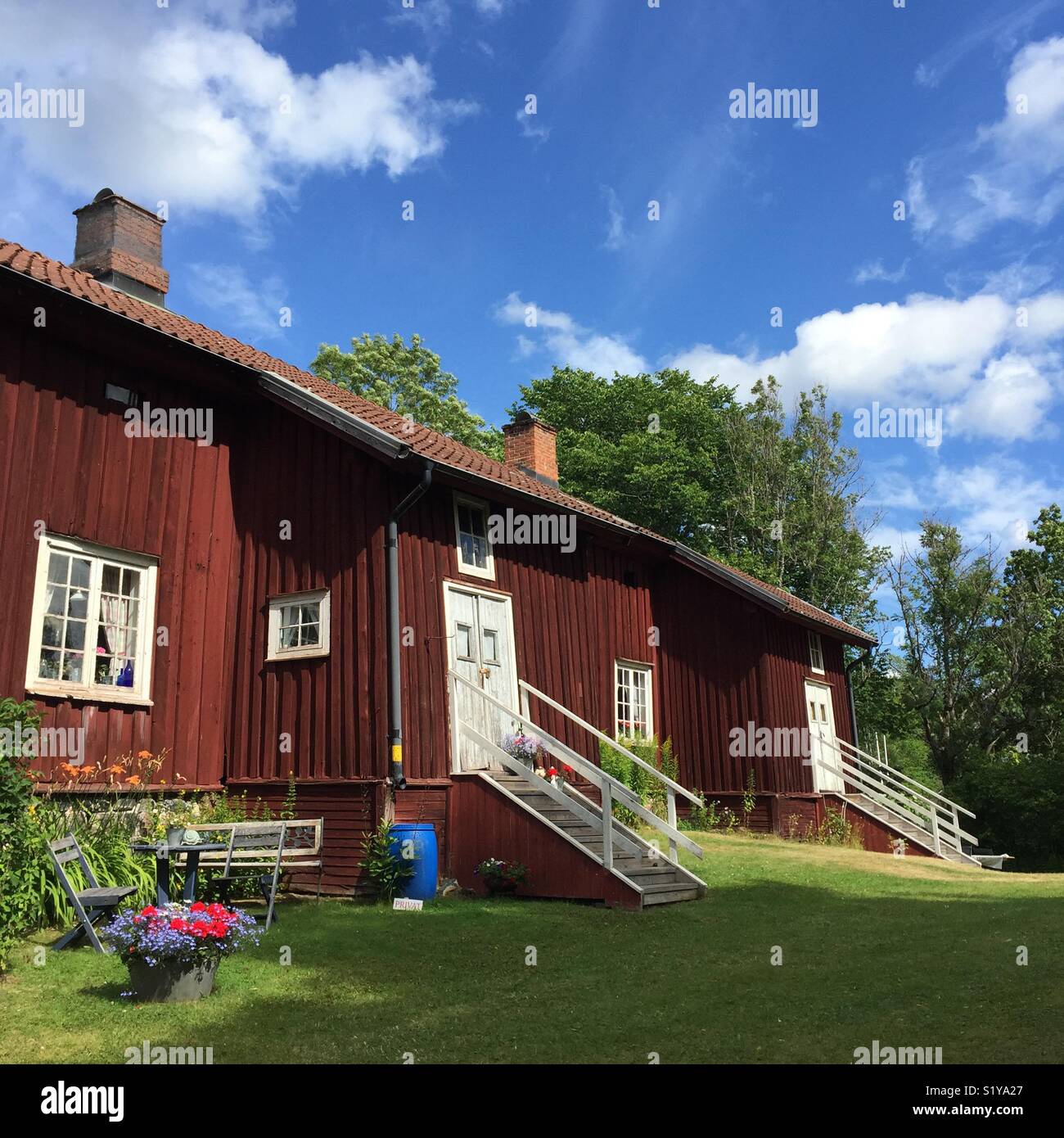 Old wooden houses painted with falu red paint Stock Photo - Alamy