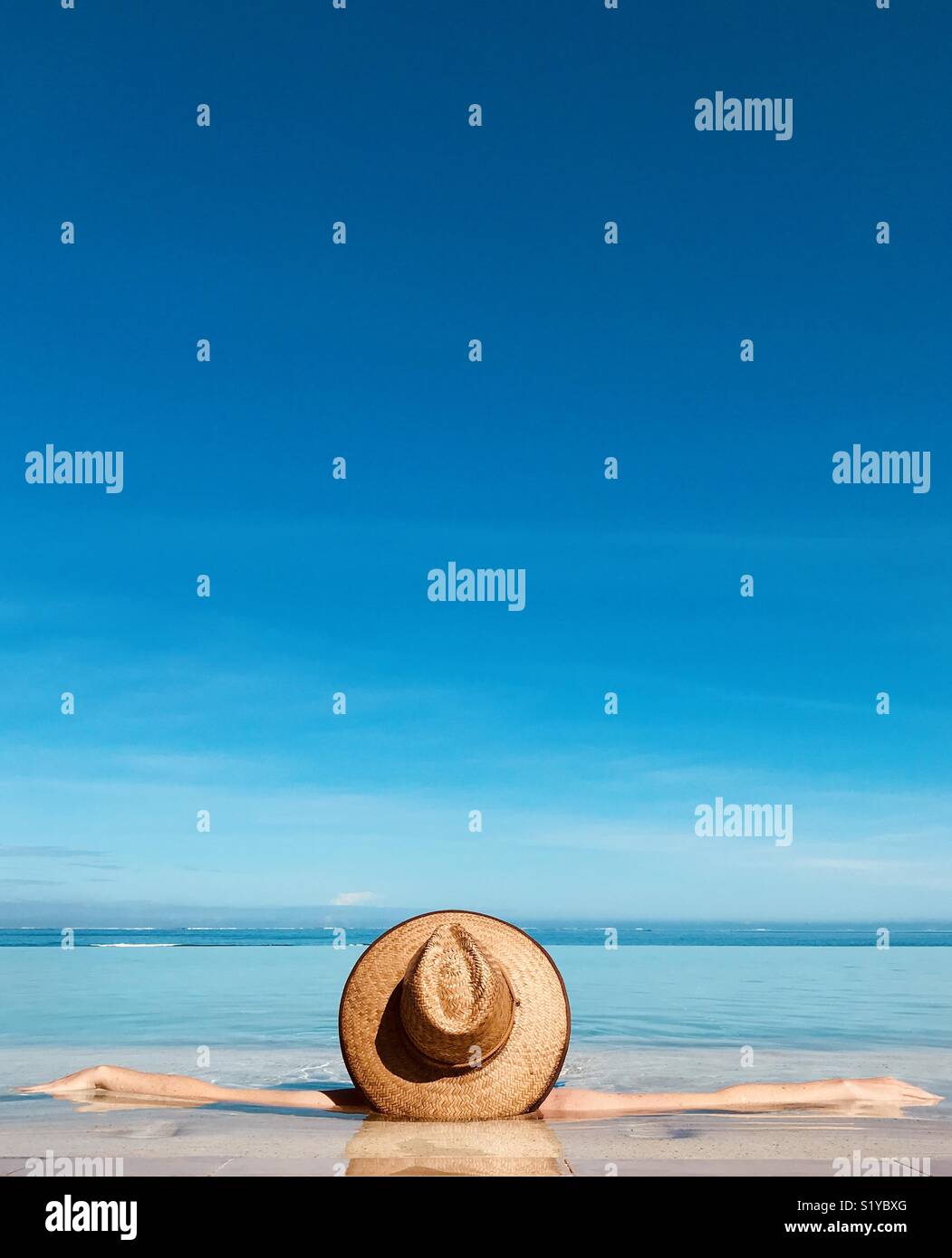 Beautiful woman laying by the pool hi-res stock photography and images ...