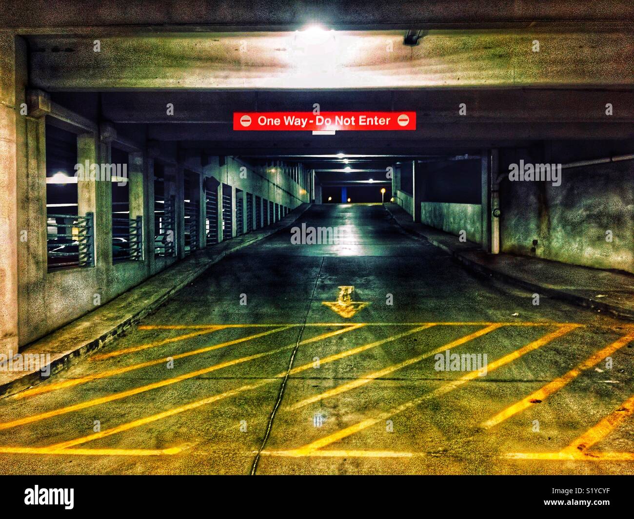 One Way- Do Not Enter area in parking garage Stock Photo - Alamy
