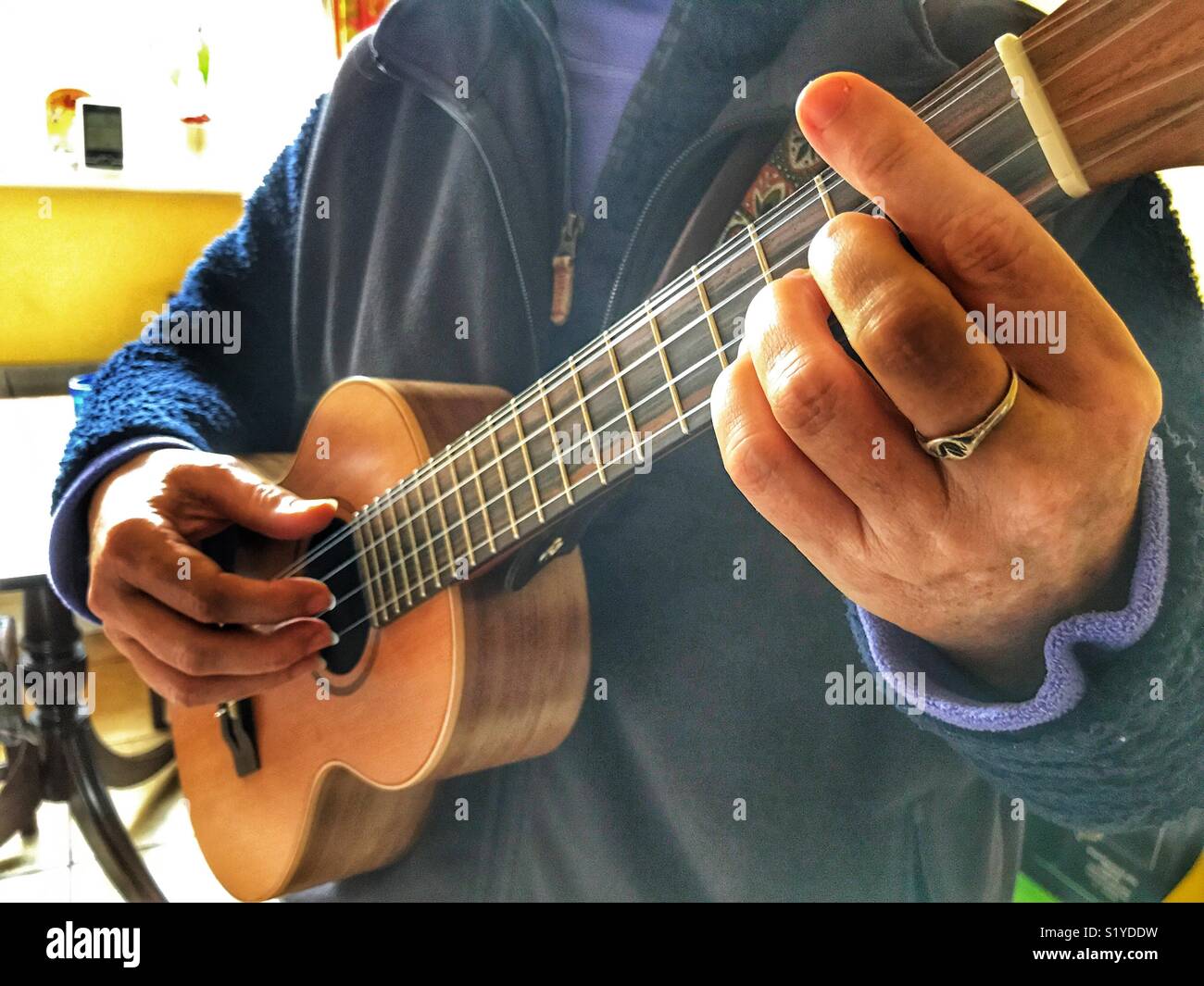 Woman playing ukulele Stock Photo - Alamy