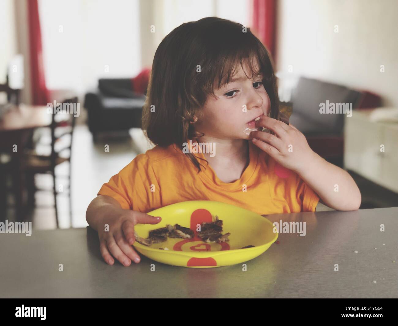 Children eating unhealthy food home hi-res stock photography and images ...