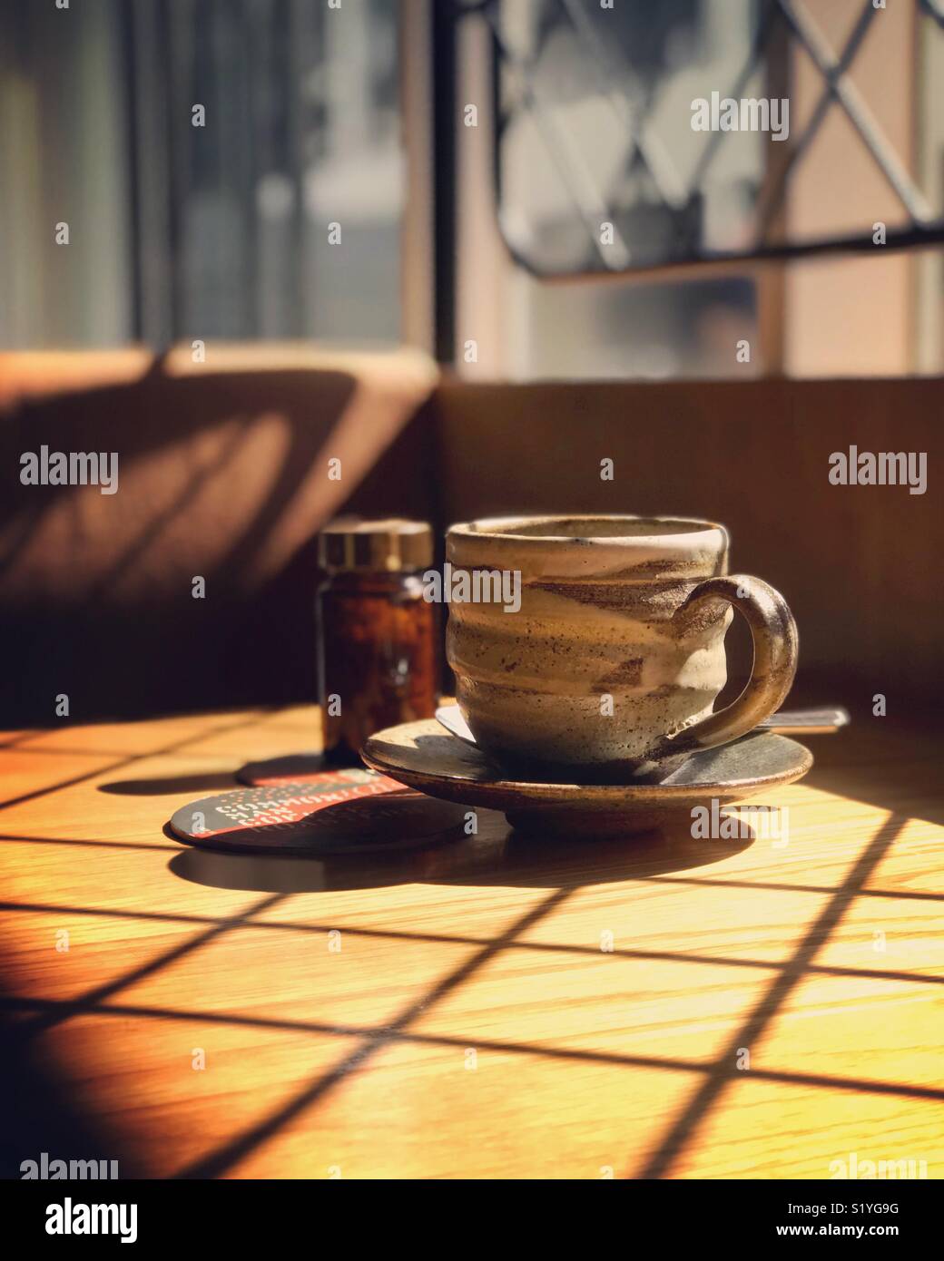 A cup of coffee under the hot sun Stock Photo - Alamy