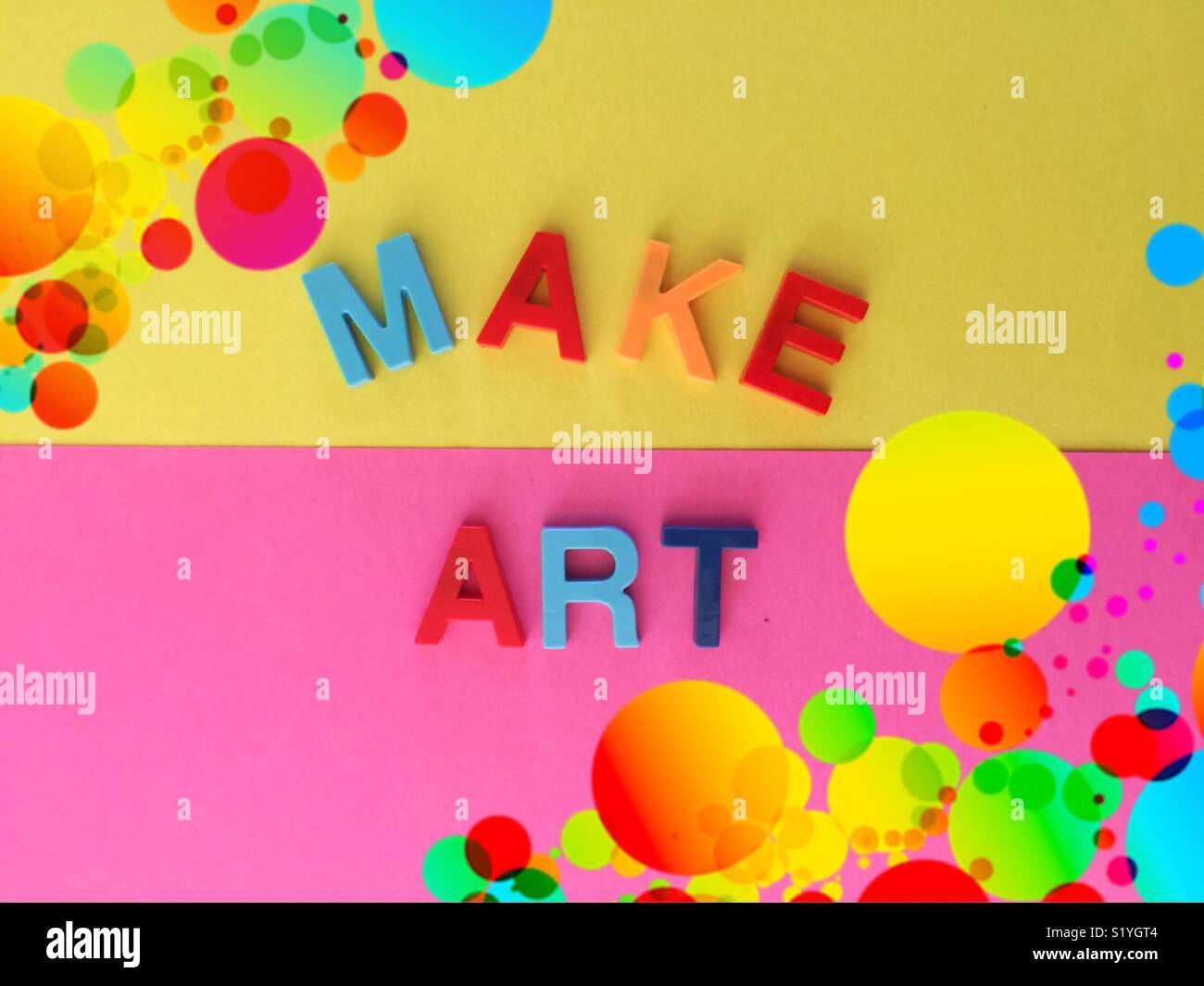 Make Art sign made with magnetic colored letters on duotone pink and ...