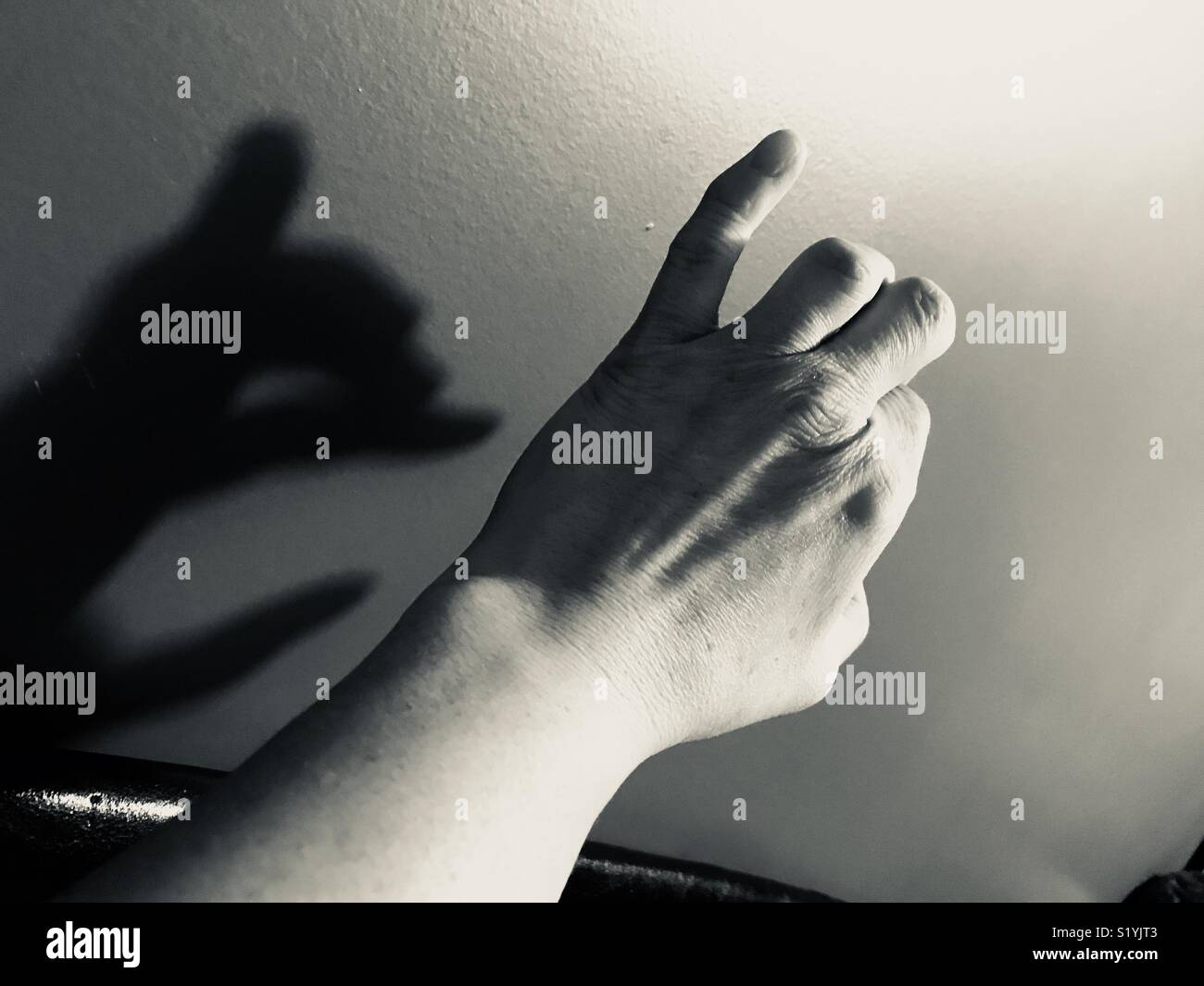 Shadow figures with hands hi-res stock photography and images - Alamy