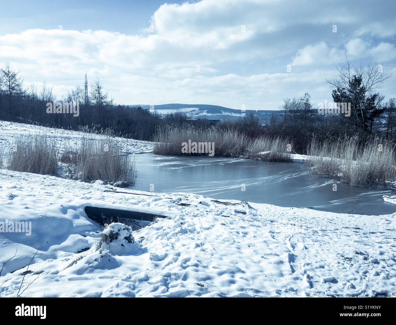 Blue sky and icy pond hi-res stock photography and images - Alamy