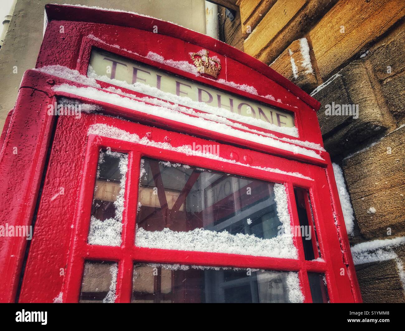 Telephone box with snow Stock Photo - Alamy