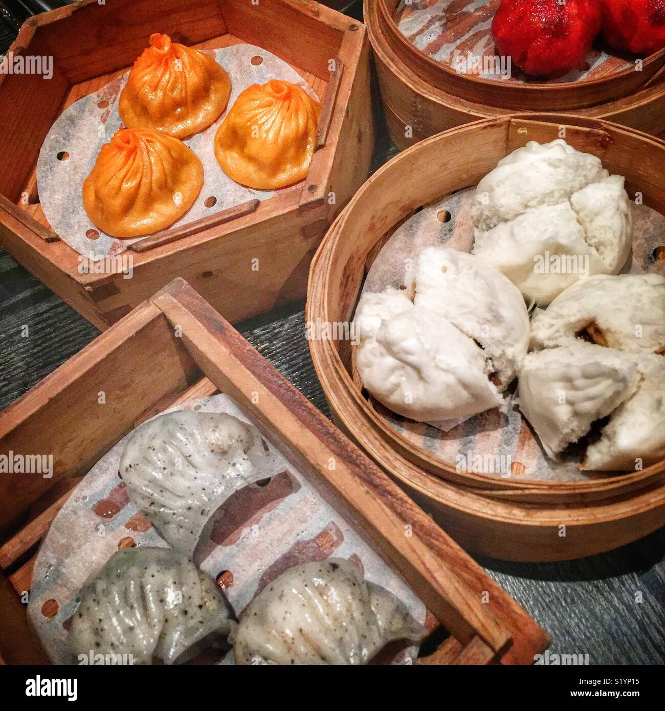 (Clockwise from TL) Dan dan xiaolong bao soup dumplings, Wild mushroom ...