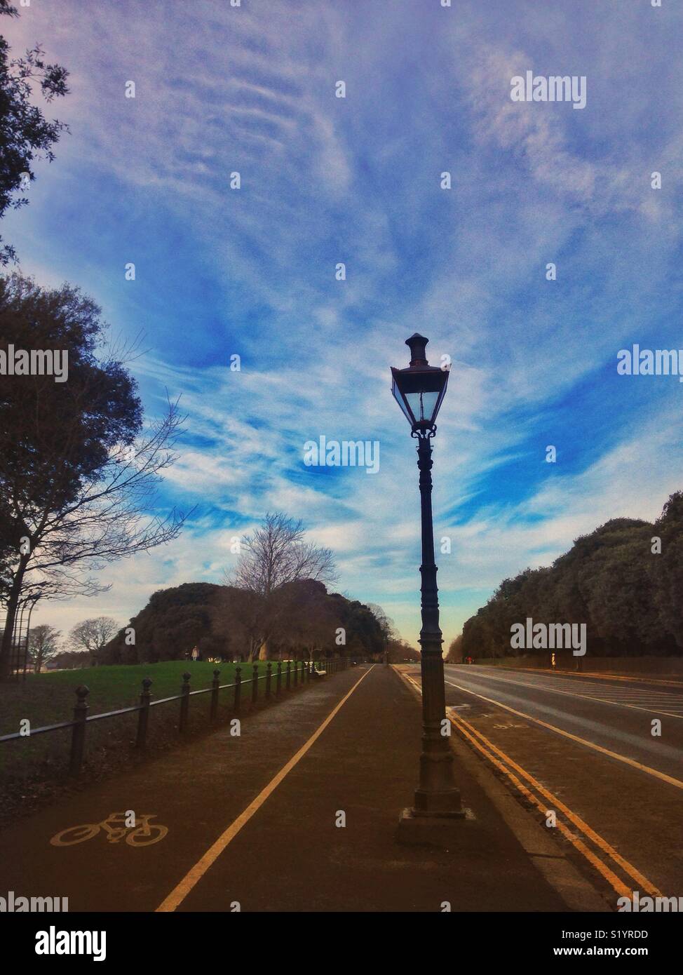 Lamp post on a road Stock Photo - Alamy