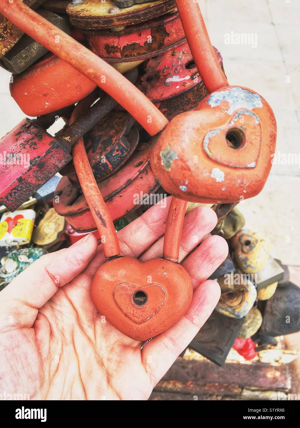 Hand holding heart shaped lock Stock Photo - Alamy