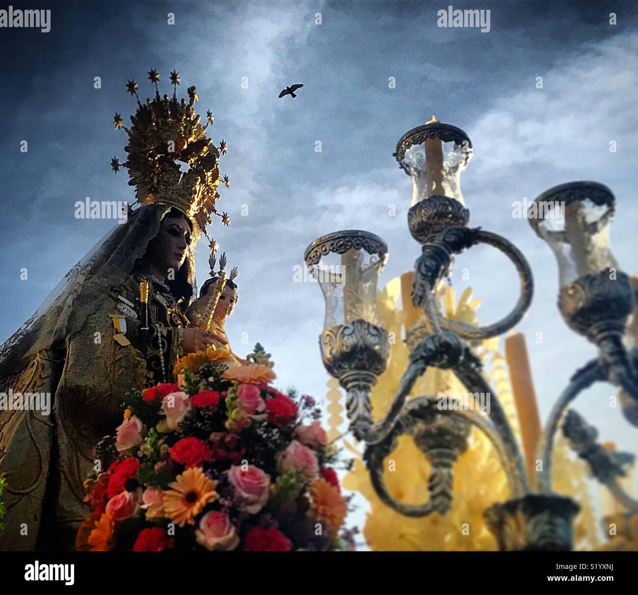 A dove flies over an image of the Virgin of Carmel during easter holy ...