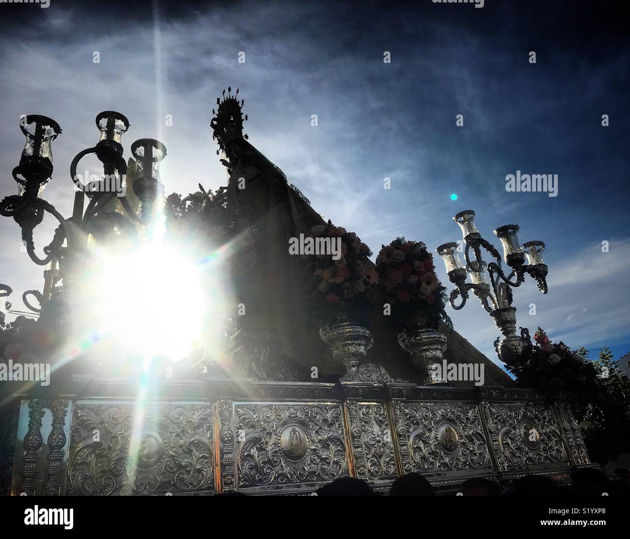 The sun shines through an image of Our Lady of Carmel during easter ...