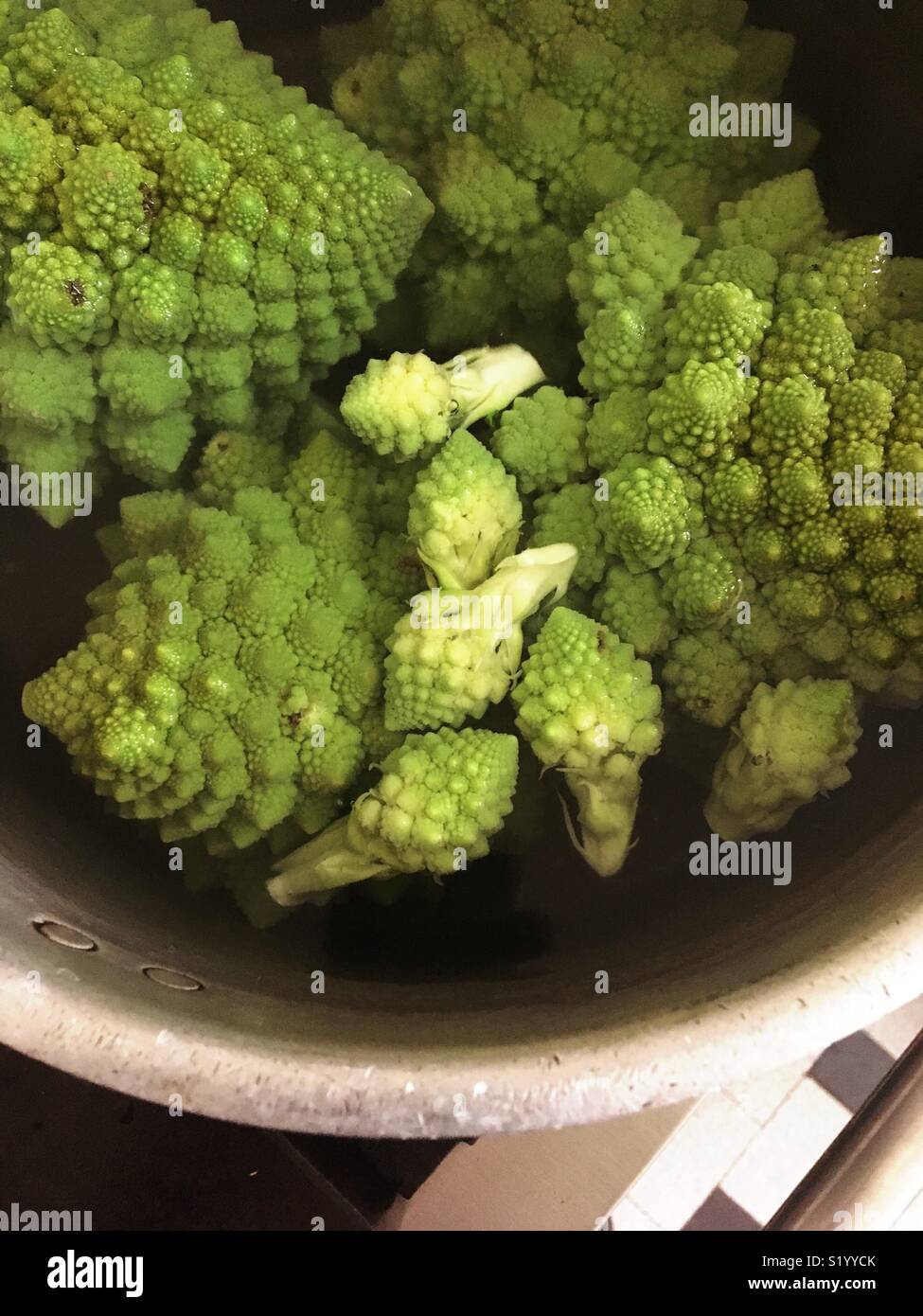 Romanesco cooking in a pot Stock Photo - Alamy
