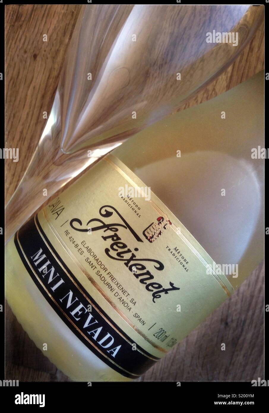 A mini (200ml) bottle of Freixenet Cava with flute glass Stock Photo ...