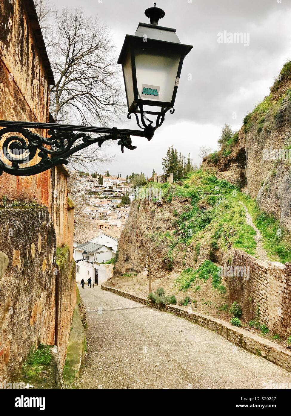 Granada, street with lamp Stock Photo - Alamy