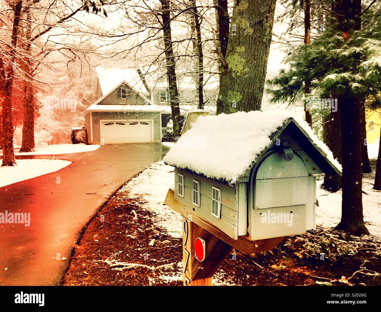 Winter scene of suburban New England luxury home and mailbox after ...