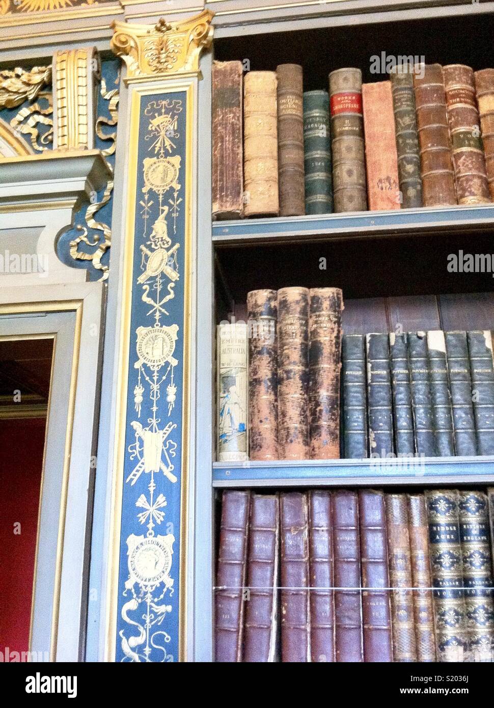 Ornate library and bound books, Warwick Castle Stock Photo - Alamy