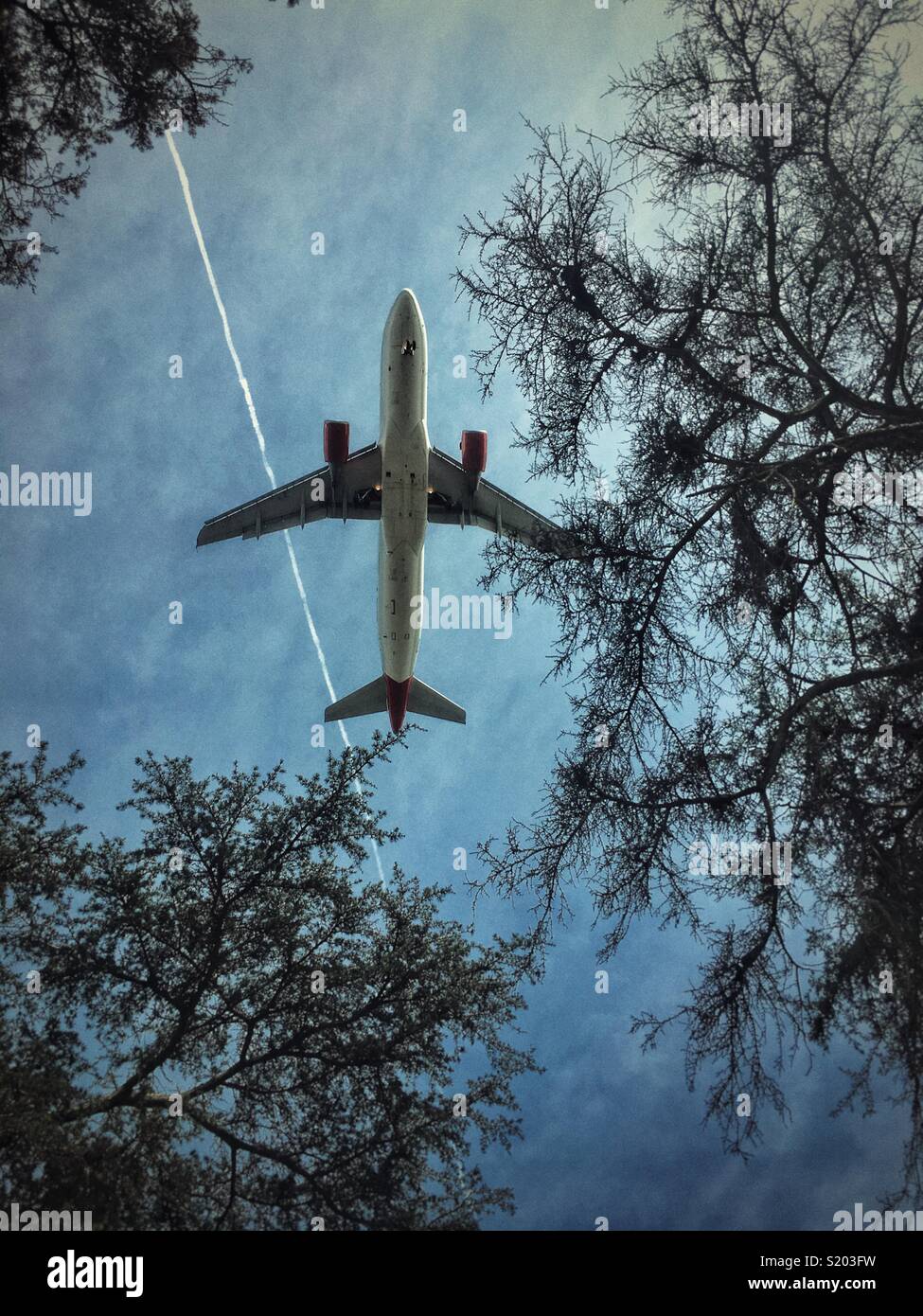 Airplane shot from the ground up Stock Photo - Alamy