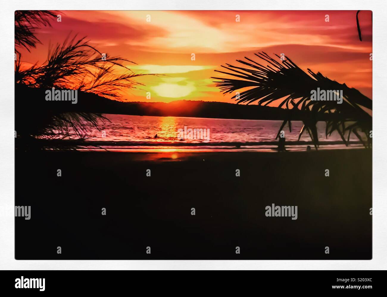 Sunset on a Thai beach Stock Photo - Alamy