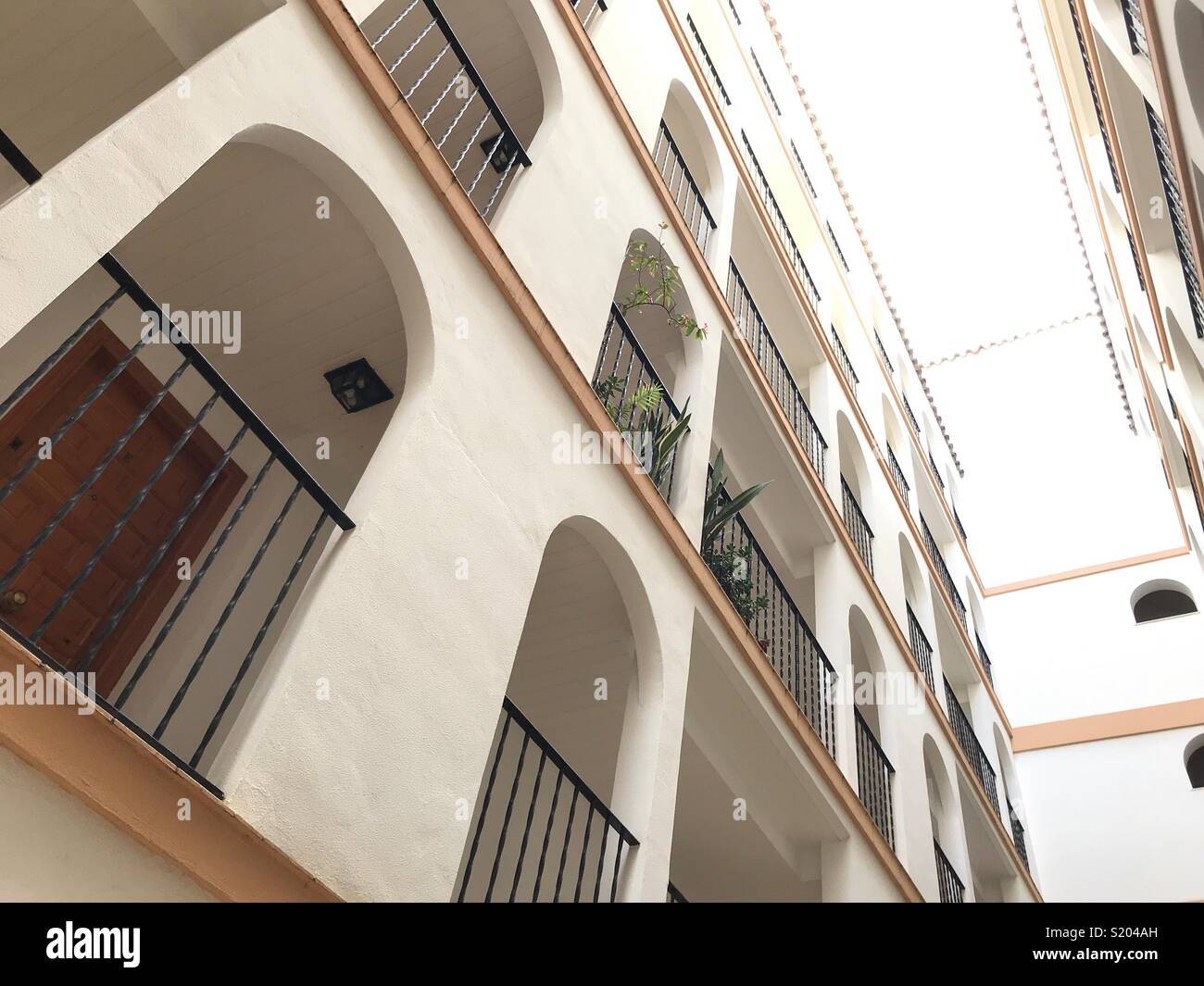 Urban living. Apartment block, low angle view from courtyard Stock ...