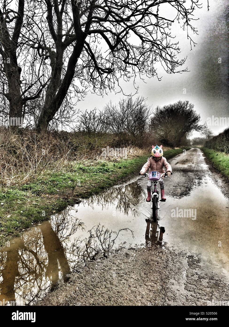 Riding through a puddle Stock Photo - Alamy