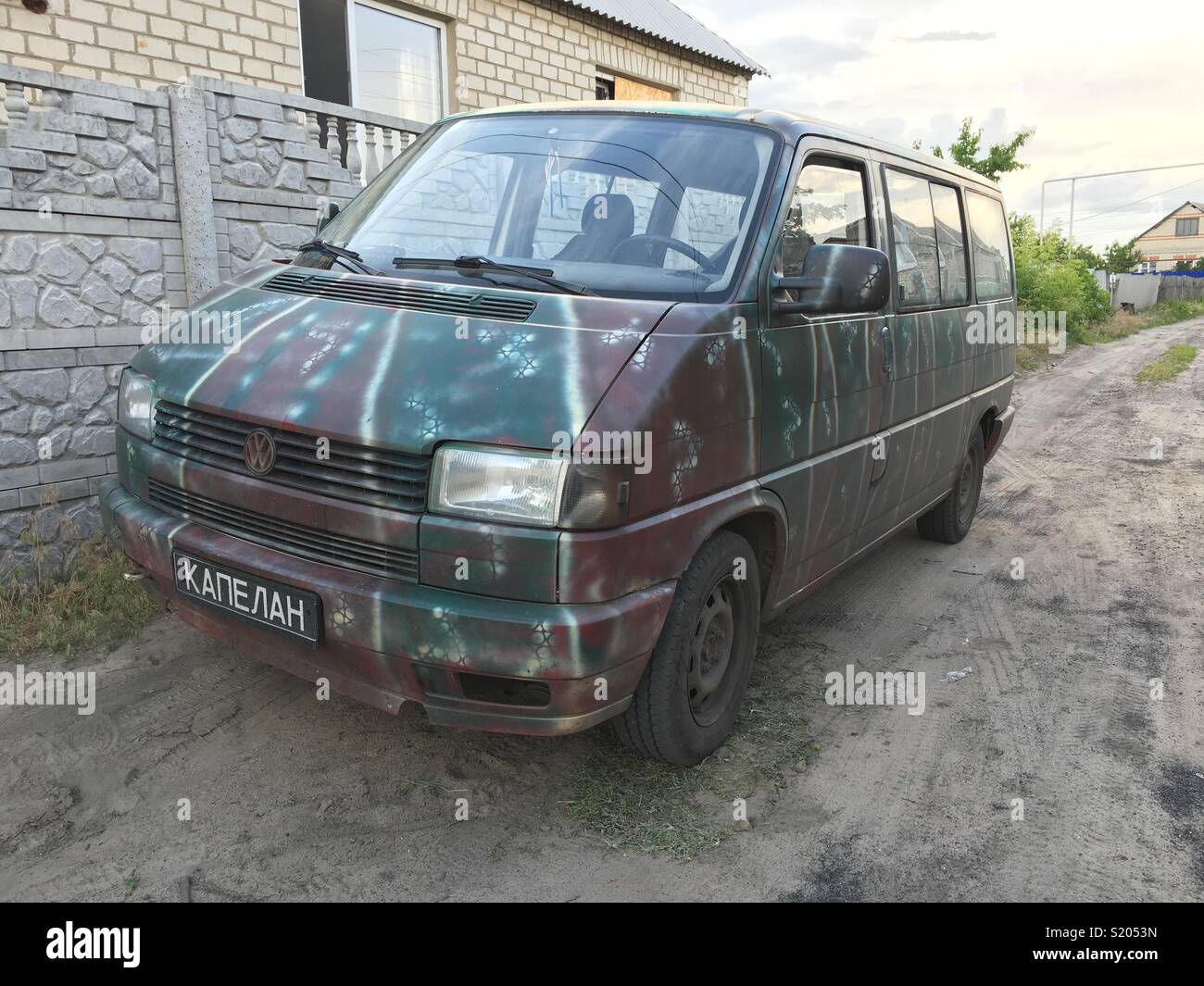 Minibus in army colors Stock Photo - Alamy