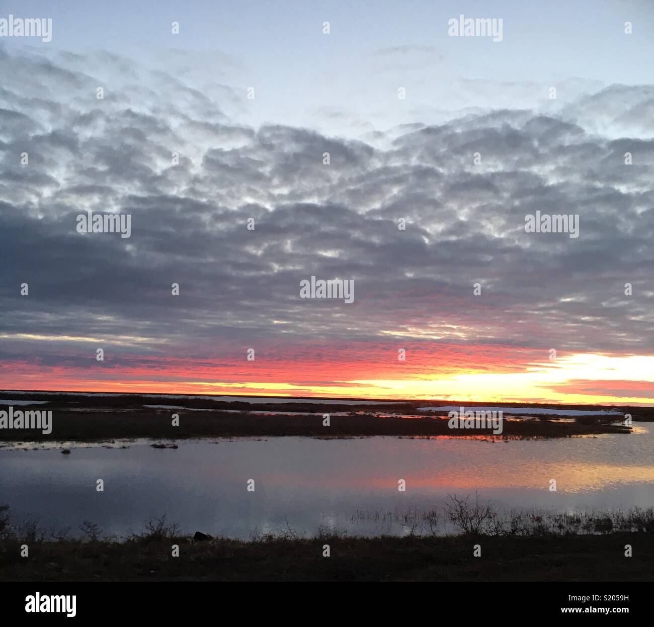 Sunset in the horizon Stock Photo - Alamy
