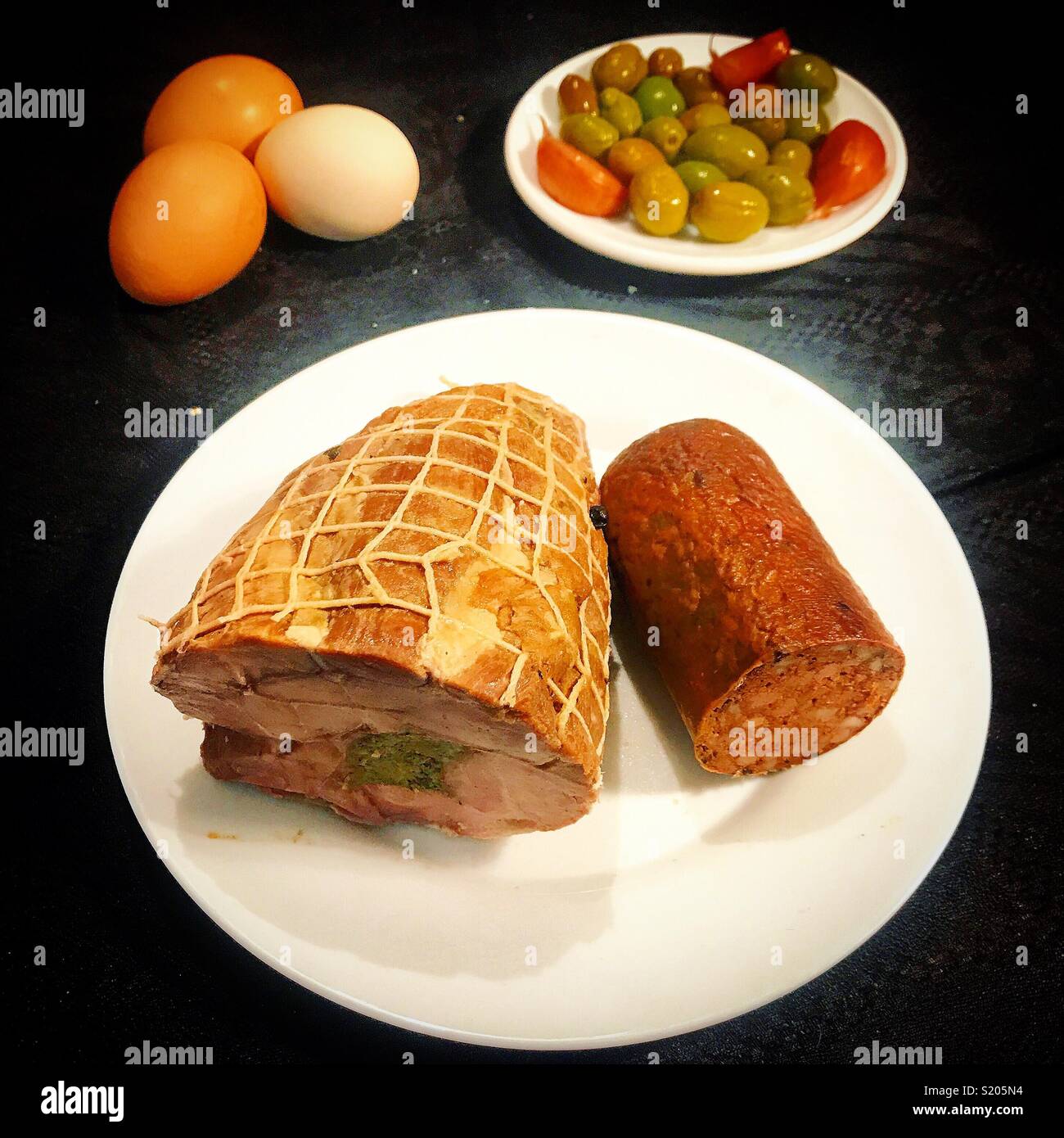 Meatloaf, blood sausage, olives with garlic and eggs in Carnicería Ana ...