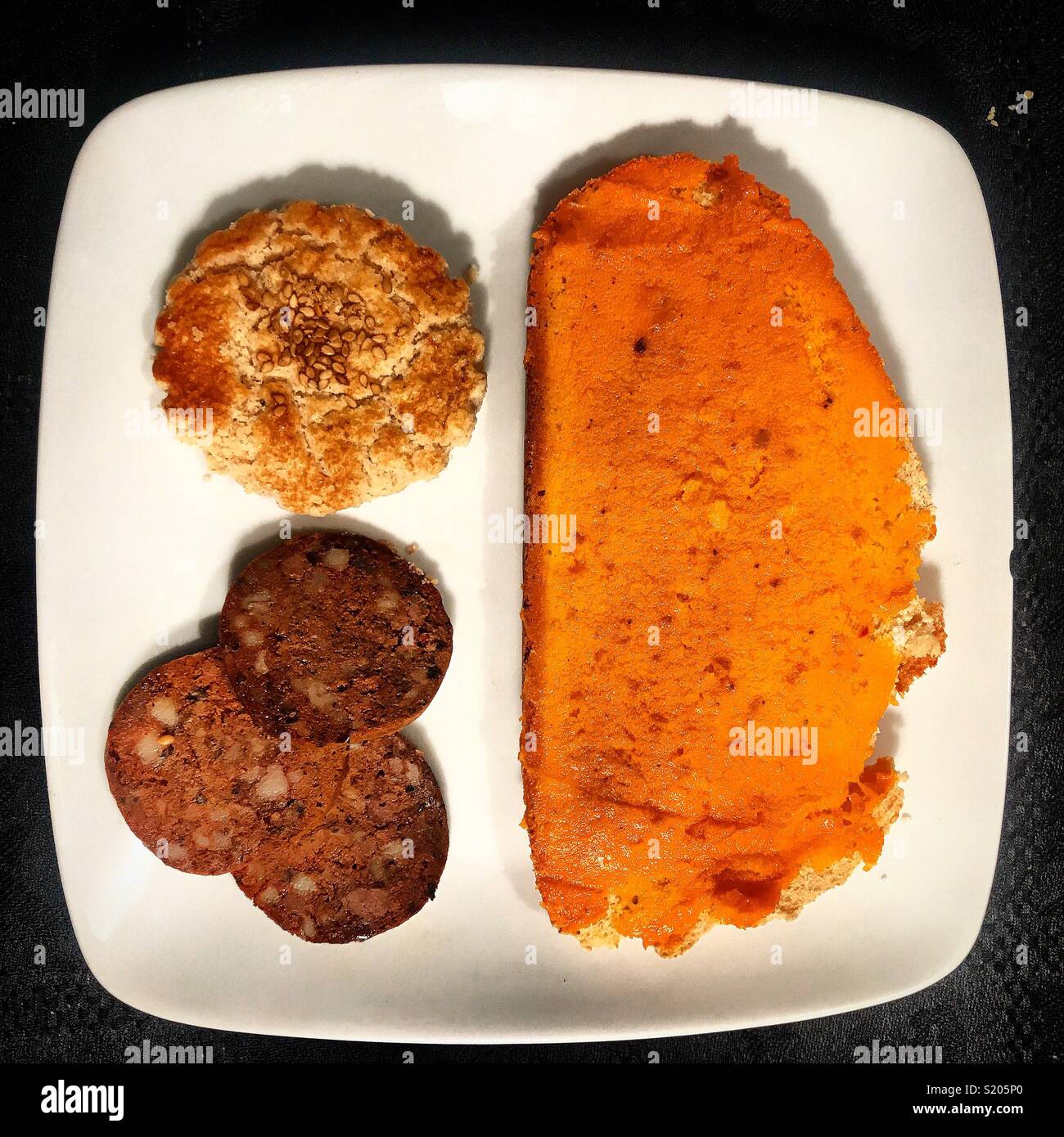 A cookie, a blood sausage and toasted bread with lard from Iberian pigs ...