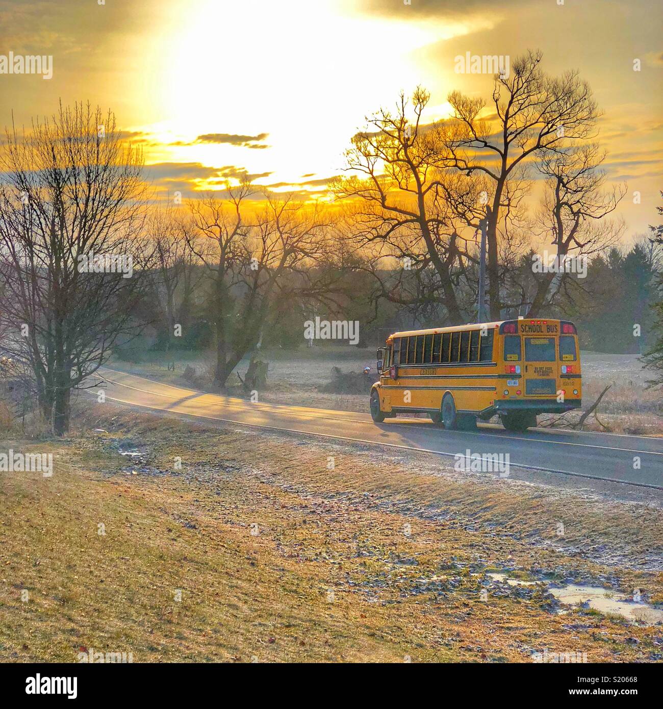 School bus driving down rural hi-res stock photography and images - Alamy