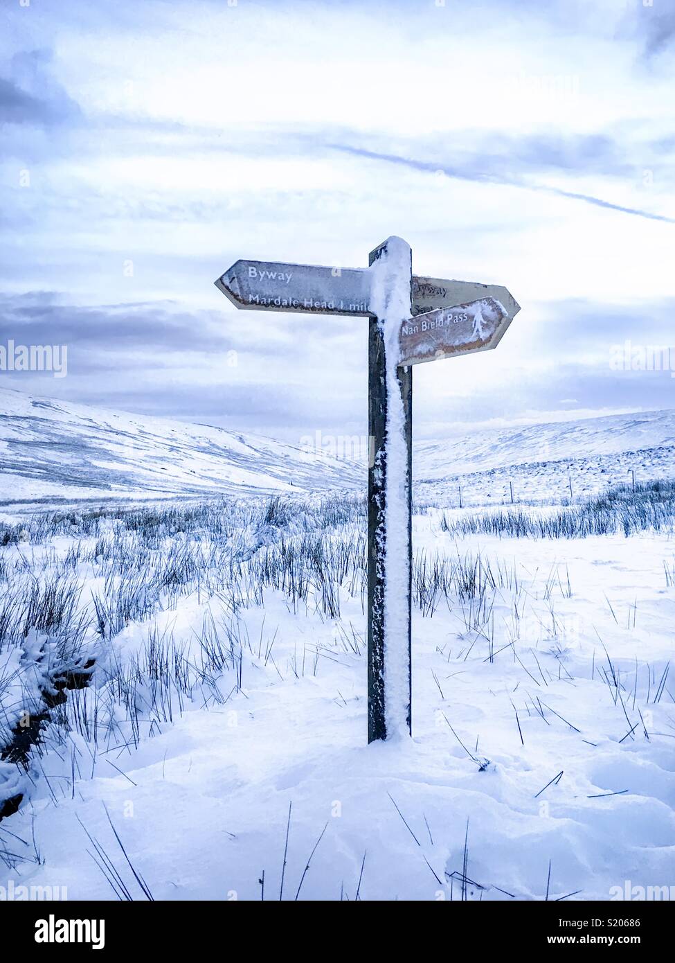 Sign of roads in snow in the mountains Stock Photo - Alamy
