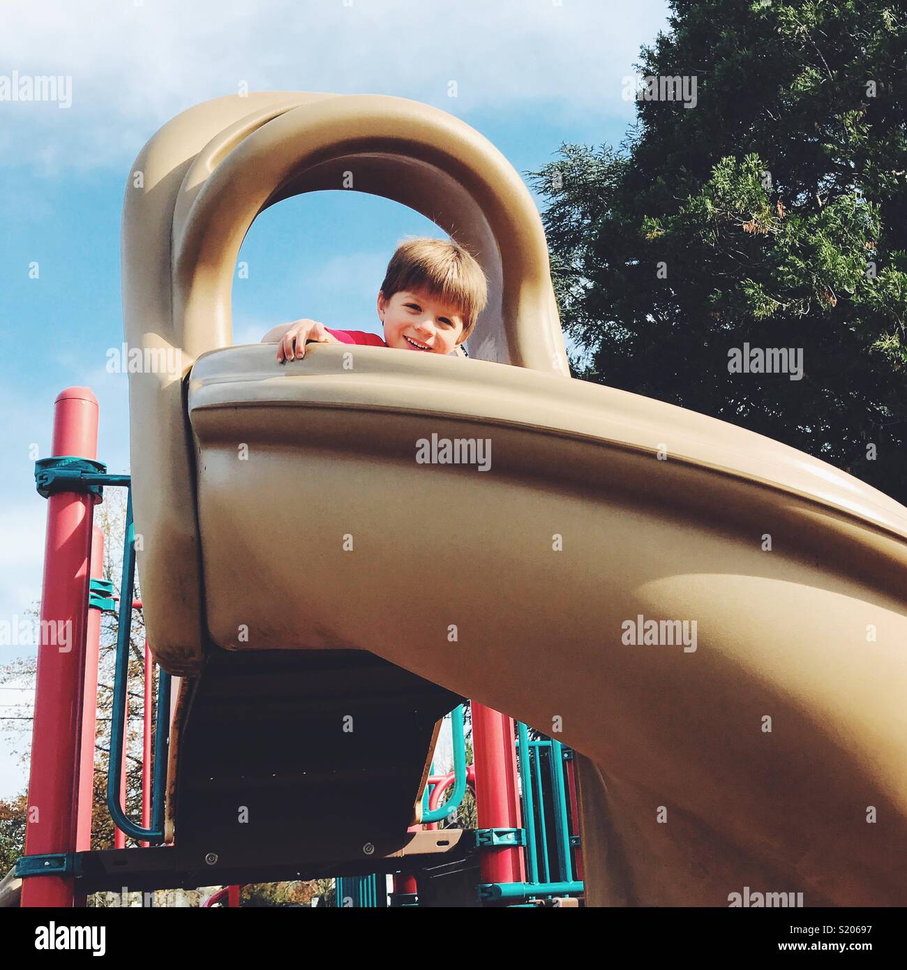 Kids on slide hi-res stock photography and images - Alamy