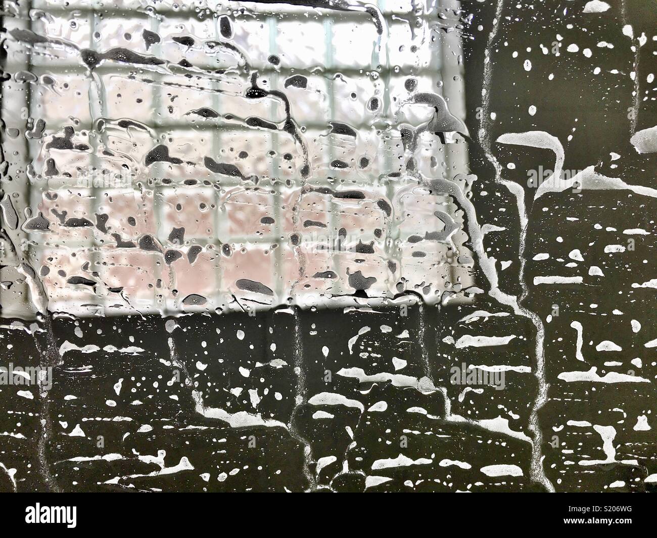 Soap on car window at the car wash Stock Photo - Alamy