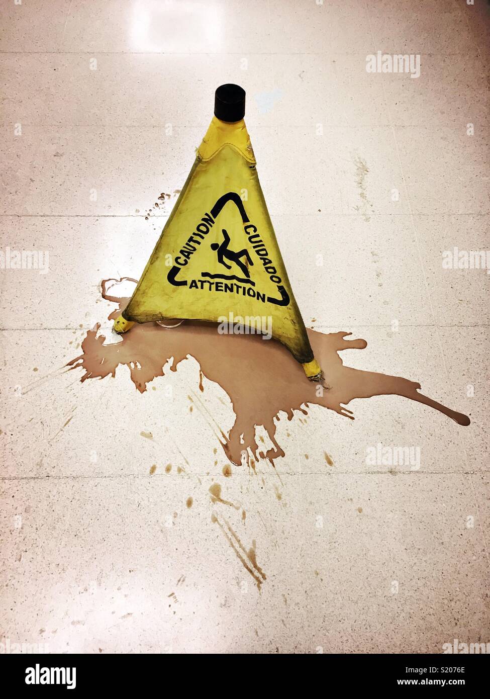 Slippery surface warning sign was placed after some liquid was spilled ...