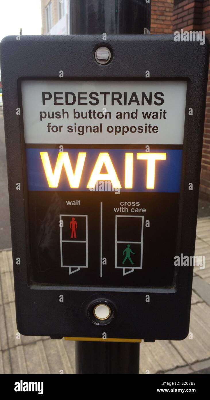 Pedestrian crossing sign illuminated: WAIT Stock Photo - Alamy