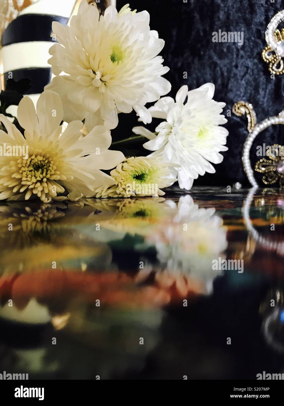 Bunch of Flowers and it’s reflection on a surface Stock Photo - Alamy