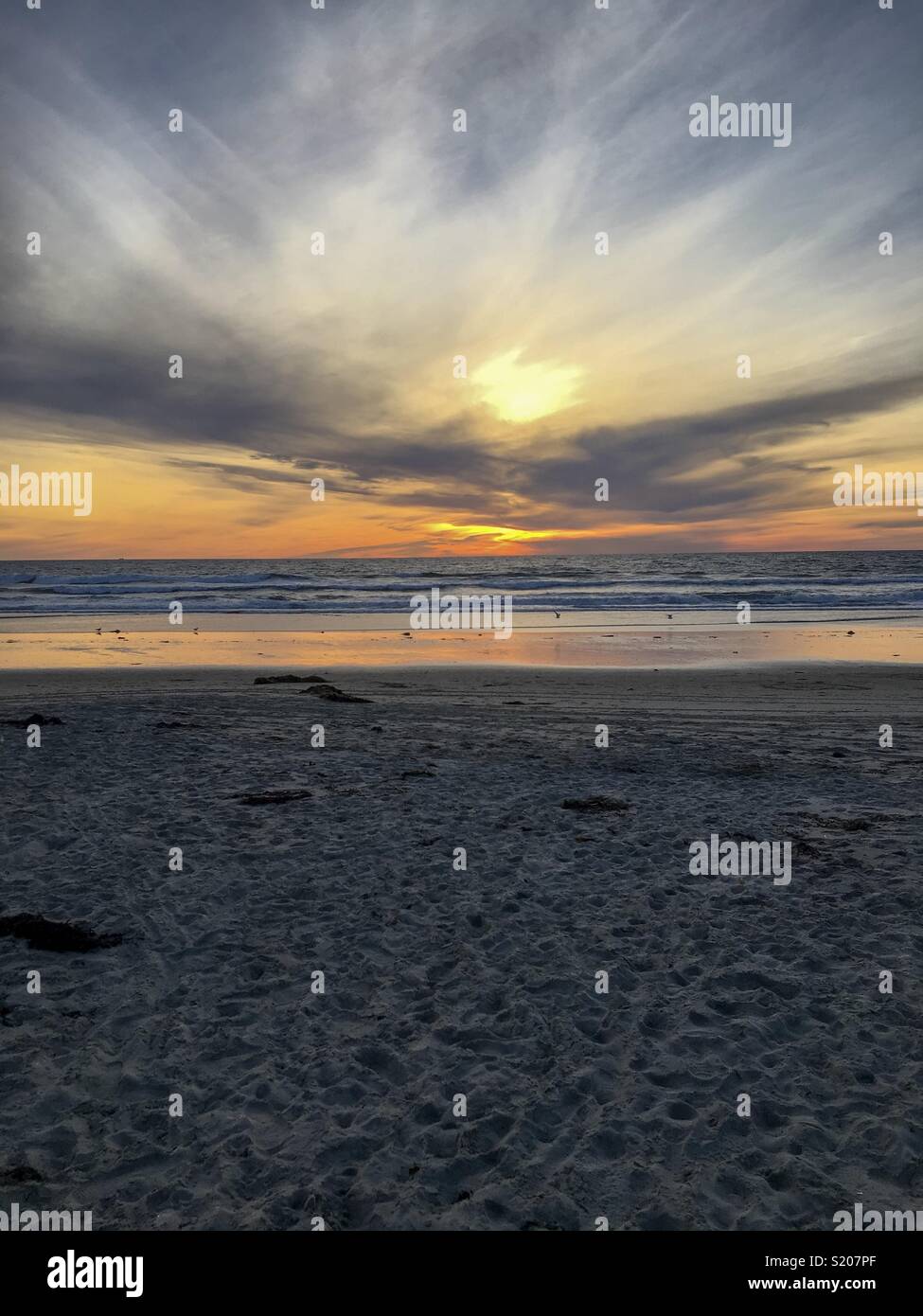 Gorgeous sunset off the coast of pacific beach Stock Photo - Alamy