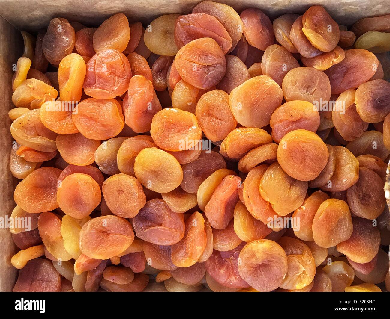 Dried apricots on a market stall Stock Photo - Alamy