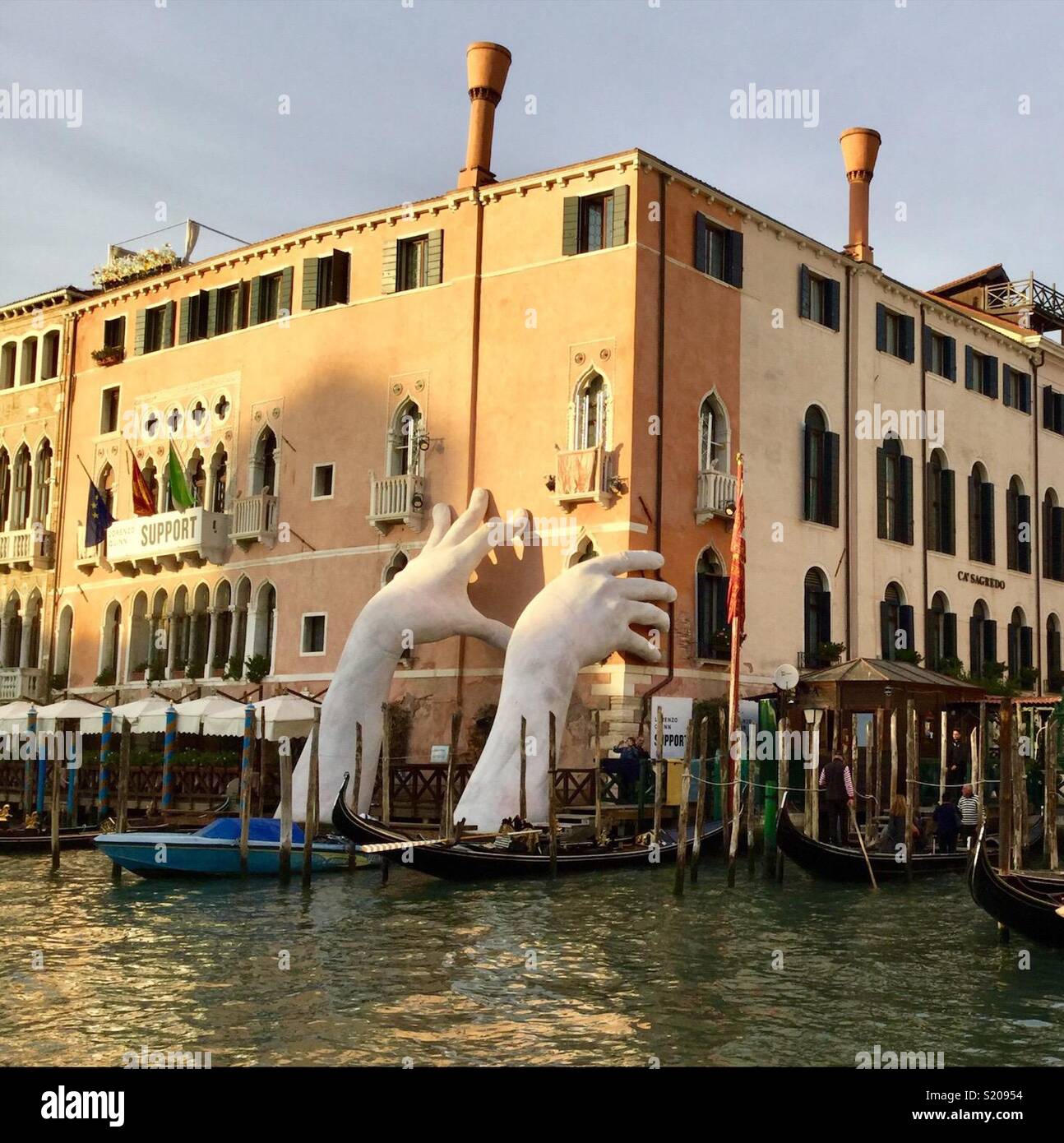 Giant Hands highlighting the Danger of Climate Change .The Grand Canal ...
