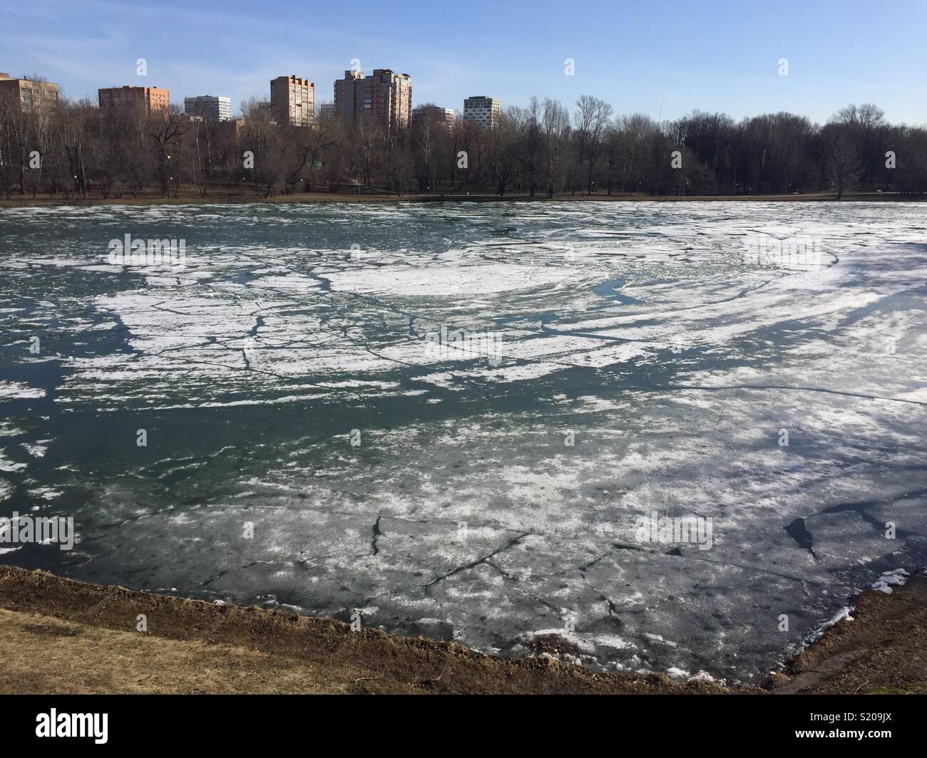 spring melting ice on a pond Stock Photo - Alamy