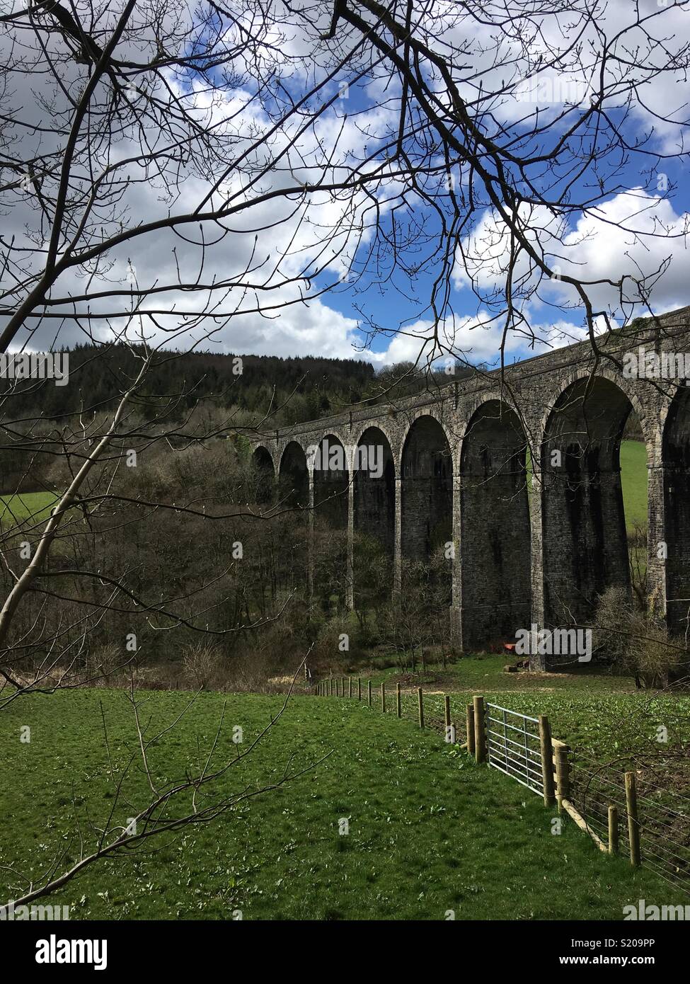 Viaduct with arches carrying an abandoned railway through the English ...
